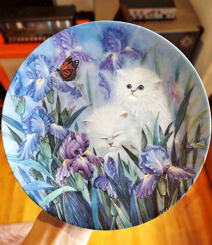 Grandma's china cabinet meets modern collector's item. This whimsical cat plate proves one person's kitsch is another's conversation starter.