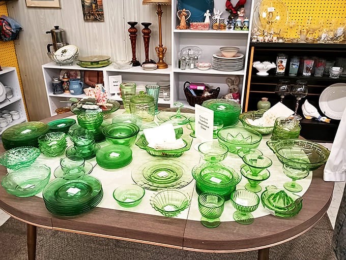 Depression glass heaven! This emerald collection gleams under fluorescent lights like a pirate's bounty, each piece whispering tales of Sunday dinners from decades past.