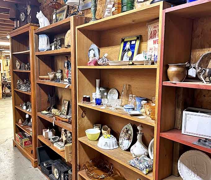 Wooden shelves strain under the weight of history, each carefully arranged collection telling stories of homes and lives from bygone eras.
