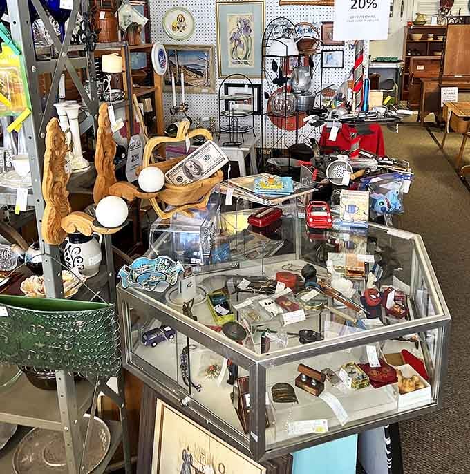 A glass case of curiosities beckons with the siren song of collectibles. That wooden figurine might just be the conversation piece your mantel needs.