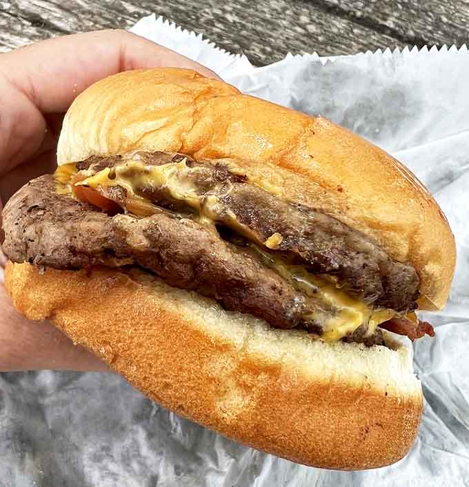 This isn't just a double bacon cheeseburger&mdash;it's edible proof that happiness doesn't need to be complicated. Just beef, cheese, bacon, and a soft bun.