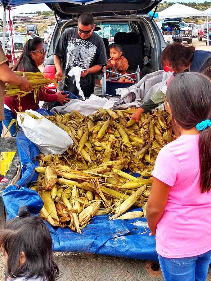 Fresh corn piled high becomes the centerpiece of a culinary conversation between generations, with recipes and traditions exchanged alongside cash.