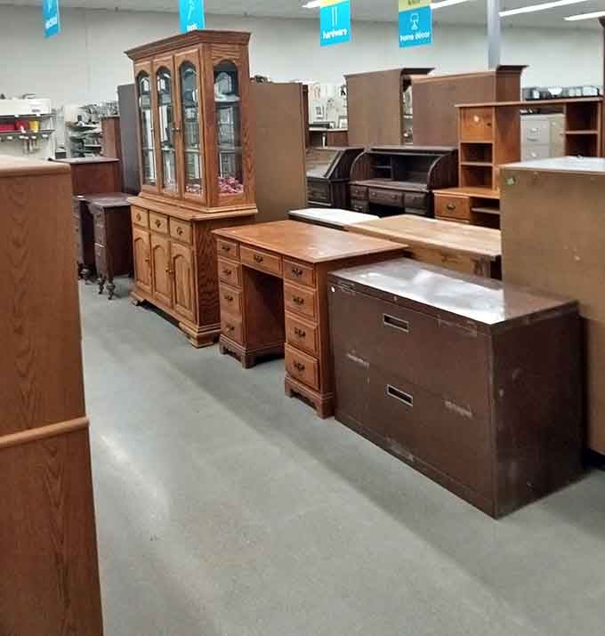 Solid oak china cabinets stand sentinel beside executive desks that have likely witnessed more business deals than most Wall Street boardrooms.