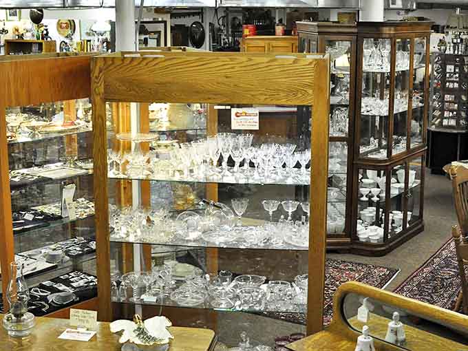 Crystal glasses sparkle under careful lighting, each delicate stem a survivor of countless toasts to life's big moments from another era.