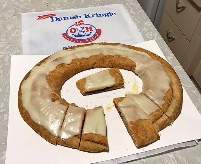 Behold the kringle in all its oval glory! Layers of flaky pastry, sweet filling, and that signature icing – resistance is futile.