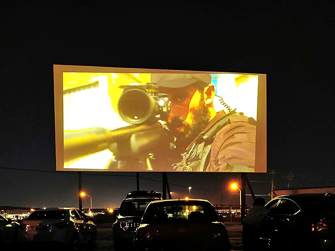 Action unfolds on the massive screen while headlights glow below like fireflies. Nothing beats watching explosions under actual stars.