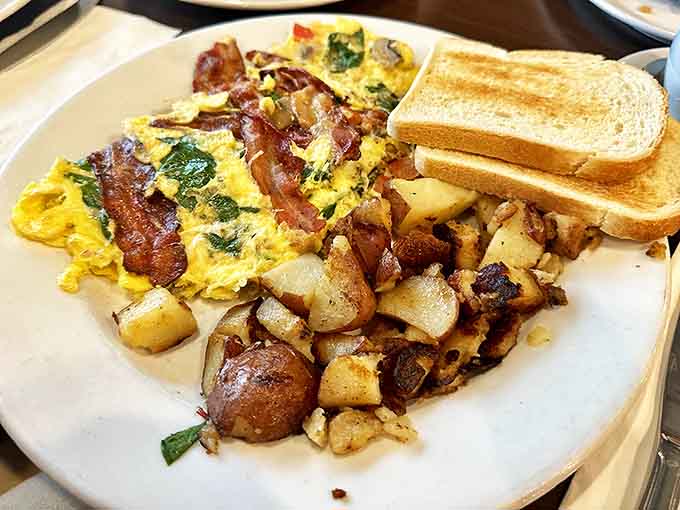 This isn't just an omelet – it's a masterclass in how eggs, veggies, and perfectly crisped home fries can transform your morning.