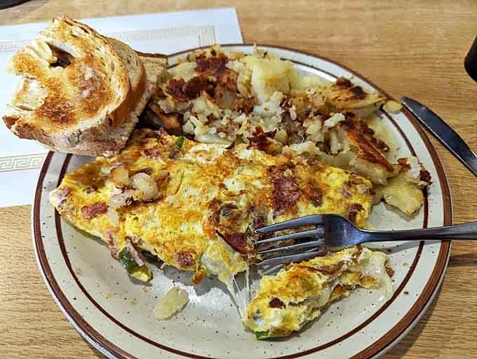 This omelet doesn't need fancy credentials&mdash;just perfectly executed simplicity, crispy-edged home fries, and toast that knows its supporting role perfectly.