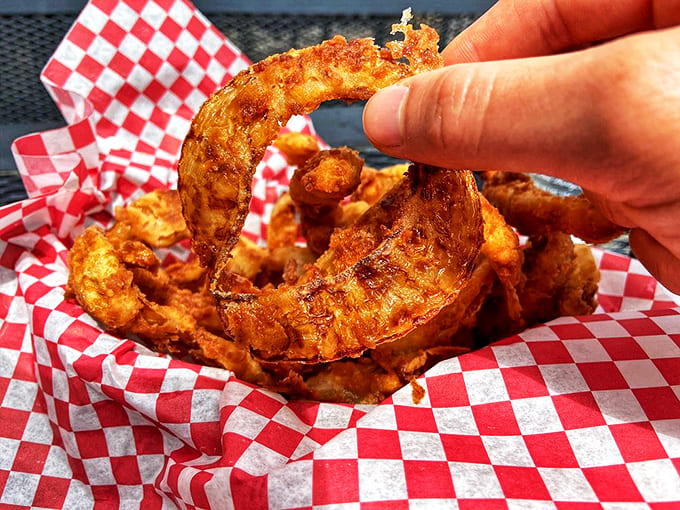 Golden halos of crispy perfection. These aren't just onion rings; they're edible jewelry that crunch with celestial satisfaction.