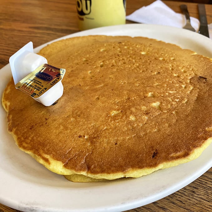 Behold the star attraction: a pancake so perfectly golden it makes you wonder if the sun itself had a hand in its creation.