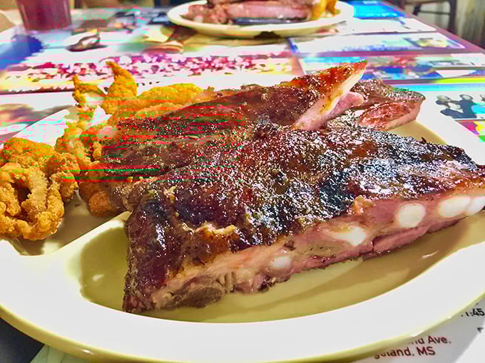 BBQ ribs so tender they practically surrender to your fork. That smoke ring isn't just for show&mdash;it's a badge of honor earned through patience and expertise.