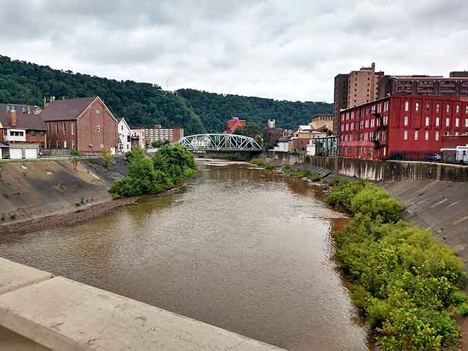 The river that once brought both prosperity and devastation now flows peacefully through concrete channels&mdash;nature tamed but never forgotten.