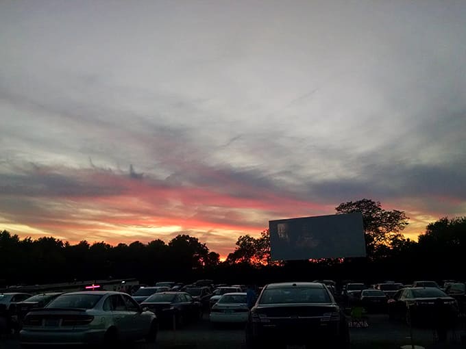 Nature provides the most spectacular opening credits as sunset paints the sky behind the screen, setting the stage for nighttime movie magic.