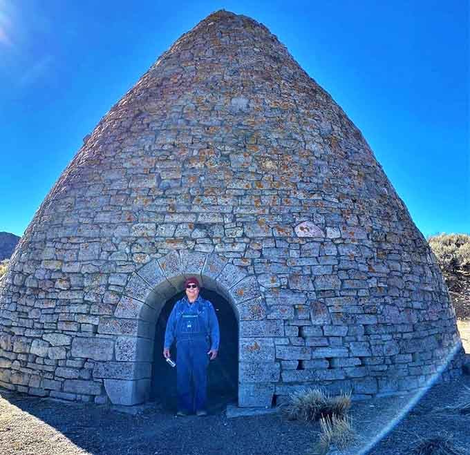 Human for scale: these ovens aren't kidding around, standing tall enough to make you feel wonderfully insignificant.