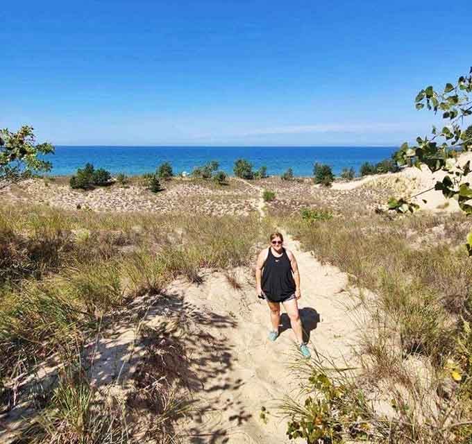 Sandy pathways wind through dunes that have stood for millennia. The trek might leave you breathless, but those Lake Michigan views? Worth every sandy step.