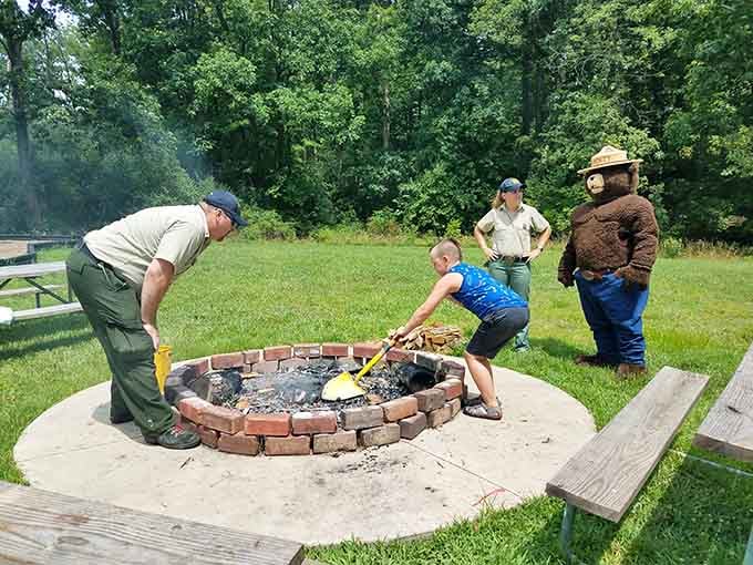 Fire safety lessons with Smokey's friends! Park rangers share wilderness wisdom while a young explorer gets hands-on experience with campfire management.