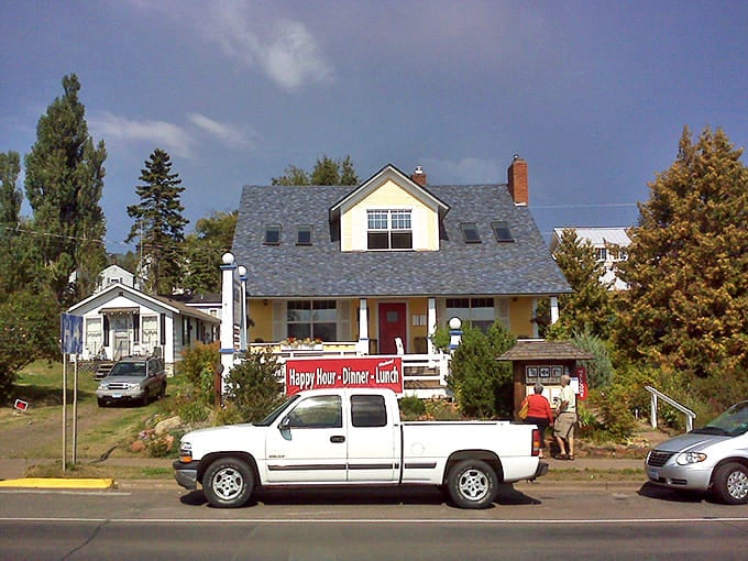 A charming yellow house with a red door in Grand Marais beckons like an old friend waiting to share stories over coffee.