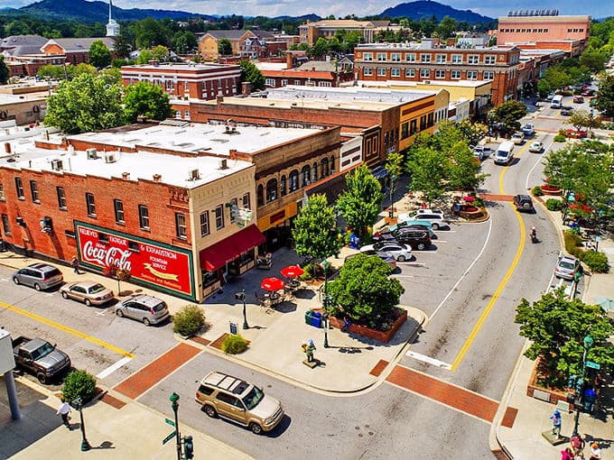 Hendersonville's downtown vista &ndash; where brick buildings, blue skies, and that classic Coca-Cola sign create small-town perfection in panorama.