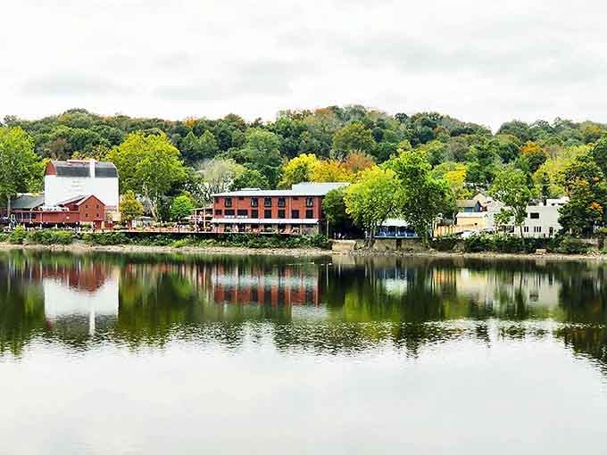 Lambertville's Delaware River waterfront creates perfect reflections, where historic buildings and autumn trees mirror themselves in peaceful waters below.