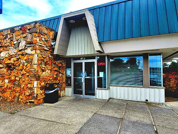 That distinctive blue A-frame roof has sheltered generations of hungry Idahoans. Inside those stone walls, pancakes are still flipped the old-fashioned way.