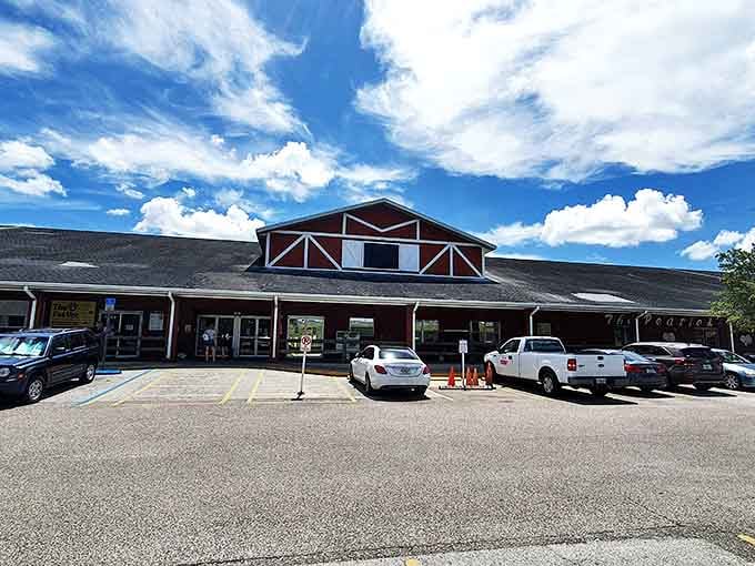 The rustic red barn exterior hides countless treasures, like a country store from your childhood memories.