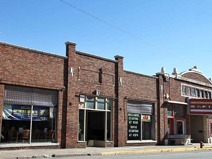 Historic brick buildings line White Hall's business district. This is where neighbors still greet each other by name.