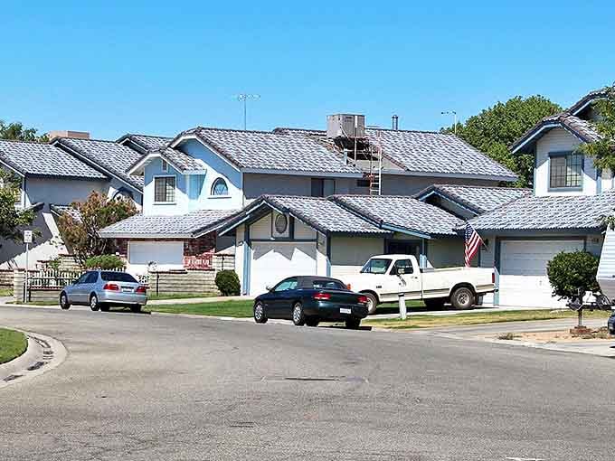 Neat rows of suburban homes with blue roofs in California City. Affordable coastal living where your retirement check buys more than dreams.