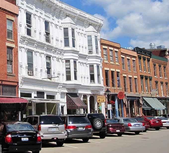 The white Victorian building gleams like a wedding cake among the brick, demanding you stop and appreciate craftsmanship.