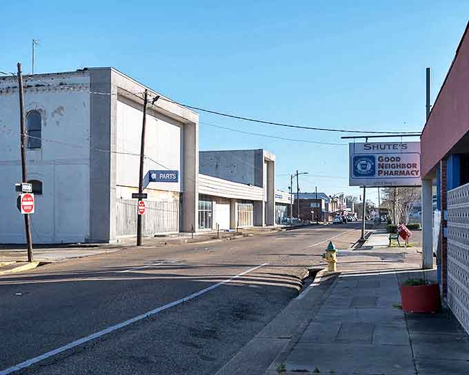 Look at that Good Neighbor Pharmacy sign! In Opelousas, your pharmacist probably still remembers which cough syrup your grandma prefers.