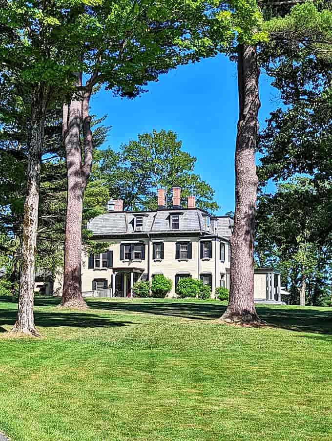 A classic New England home in Stockbridge sits proudly among towering trees – they've been neighbors for centuries.