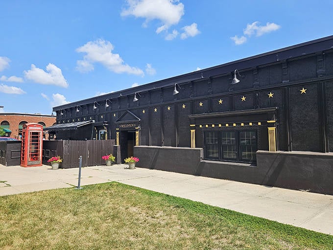 A classic British phone booth stands guard outside this black-walled pizza palace, where Midwestern magic meets Chicago-style depth.