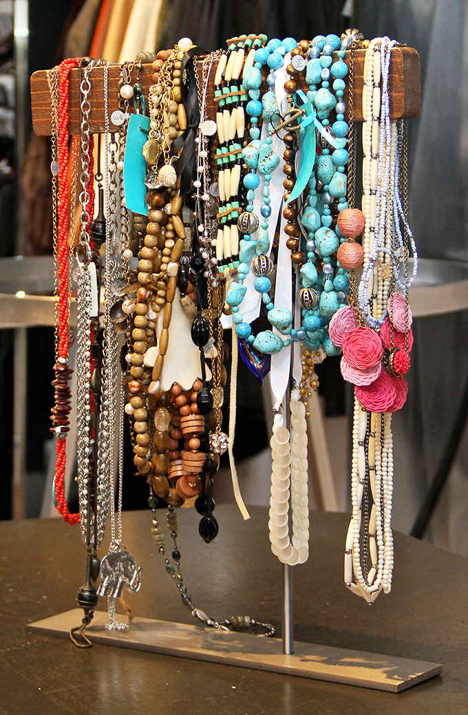 Turquoise beads, wooden elements, and vintage charms&mdash;this jewelry display isn't just accessories, it's wearable Colorado history with stories woven into every strand.