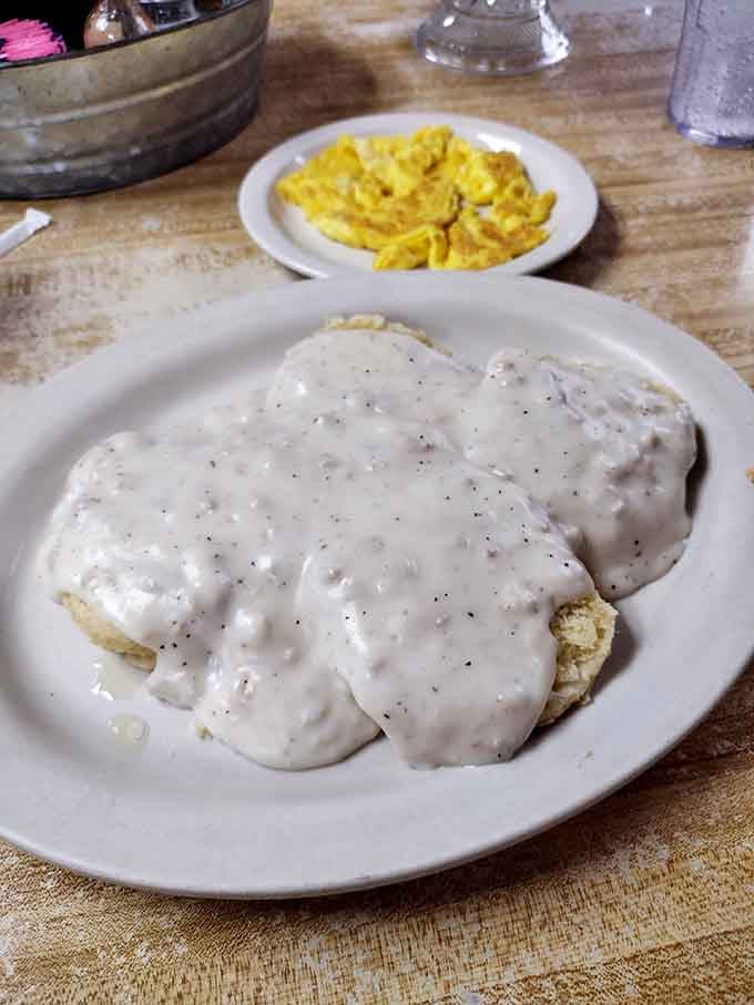 Biscuits and gravy so good they should require a permission slip. That pepper-speckled gravy isn't messing around.