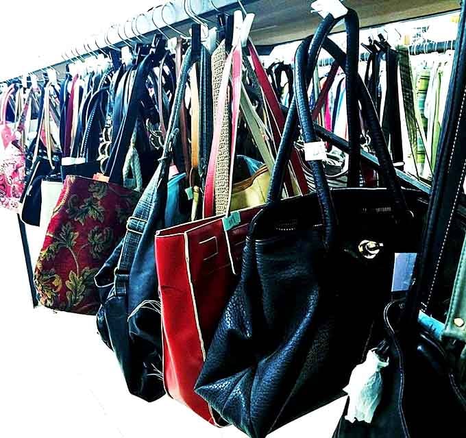 Handbag heaven hanging in suspended animation. Each one has stories to tell&mdash;some were prom night companions, others survived countless grocery runs.