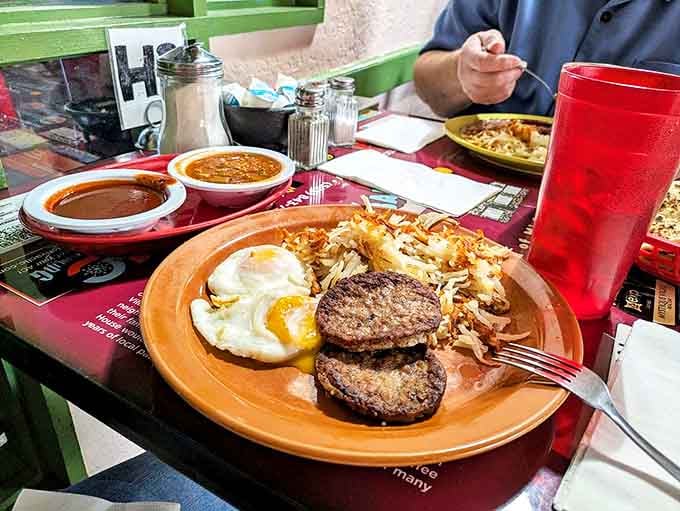 Breakfast of champions! Two perfectly cooked patties, sunny-side-up eggs, and hash browns&mdash;proof that mornings in New Mexico start with serious sustenance.