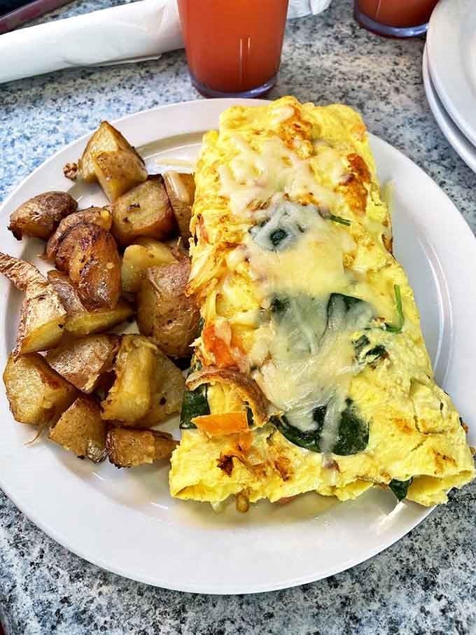 This omelet doesn't just contain vegetables&mdash;it showcases them like the headliners at a culinary concert. Those potatoes deserve their own fan club.