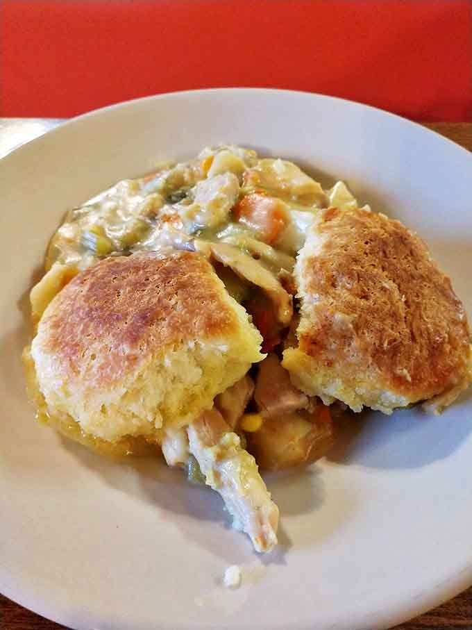 Chicken pot pie that doesn't just warm your stomach but hugs your soul. Those biscuits could end family feuds.