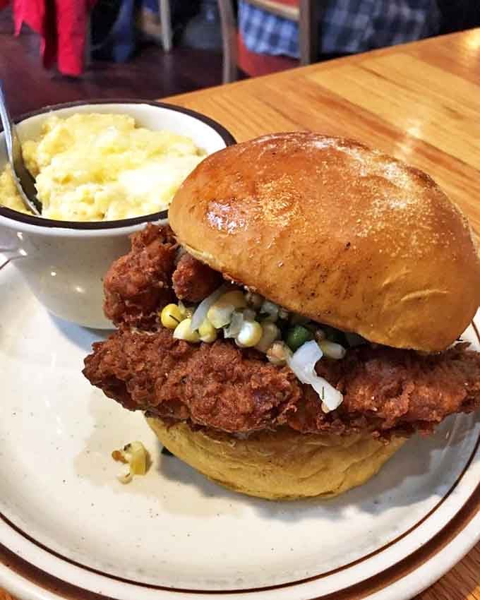 The fried chicken sandwich that launched a thousand cravings. Golden-brown perfection with corn relish that makes fast food chains weep with inadequacy.