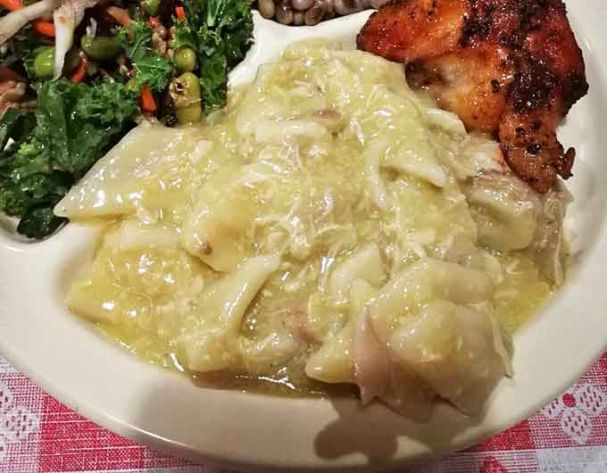 Cloud-like dumplings swimming in rich broth alongside tender chicken – the kind of comfort food that makes you want to call your mother and apologize for ever leaving home.