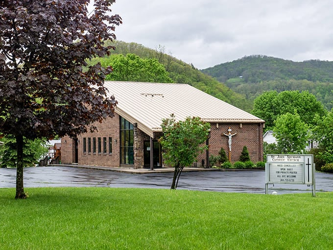 Nestled against verdant hills, this brick church offers spiritual sanctuary with architectural flair that would make even the most dedicated atheist appreciate its beauty.