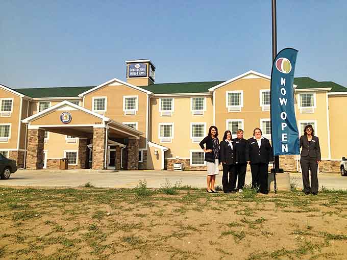 The Cobblestone Hotel rises from the prairie like a mirage, offering weary travelers a comfortable oasis in Beulah's embrace.