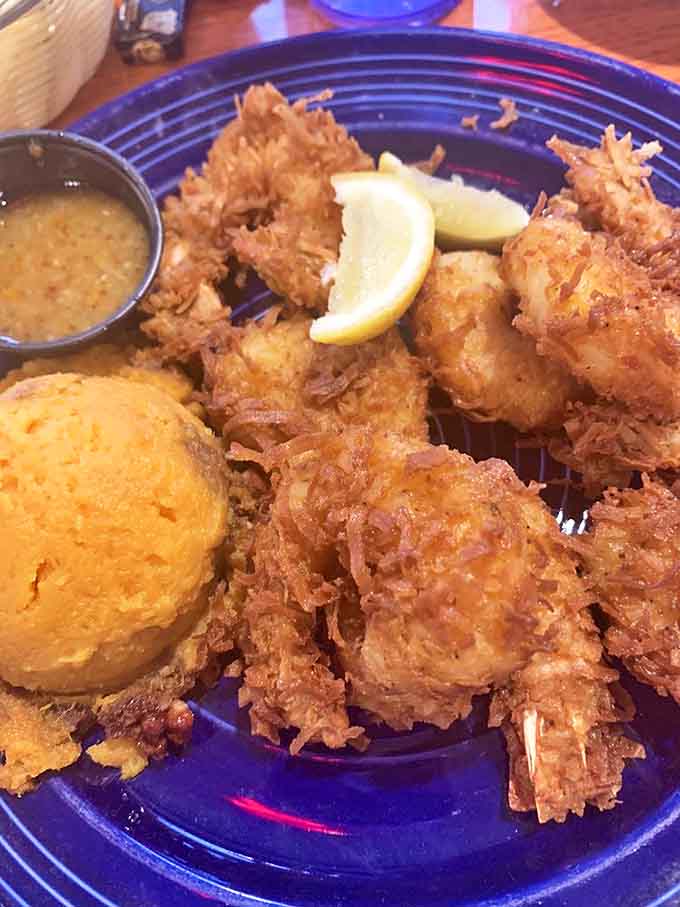 Coconut shrimp that could make you weep with joy, paired with a sweet potato side that's practically asking for its own fan club.