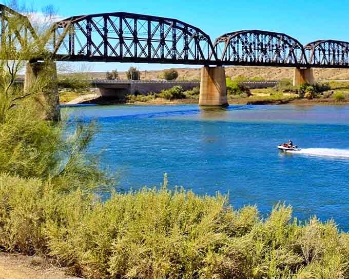 The historic Parker bridge spans more than just water&mdash;it connects desert communities while providing the perfect frame for river adventures below.