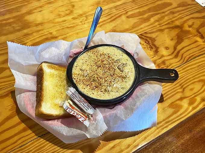 This isn't just corn chowder; it's New England comfort in a cast iron skillet. The toast stands ready for inevitable dunking.