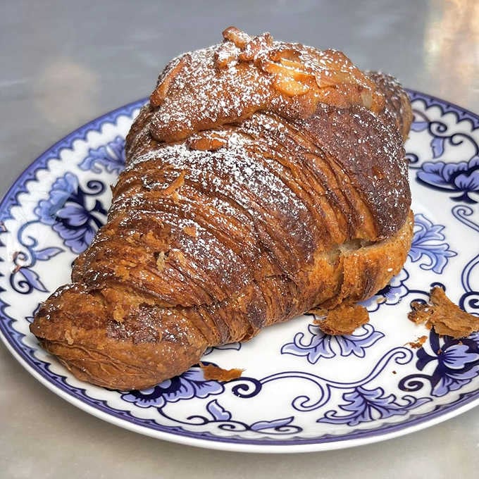 Behold the croissant in its natural habitat&mdash;flaky, buttery, and dusted with powdered sugar. Resistance is futile, my friends.