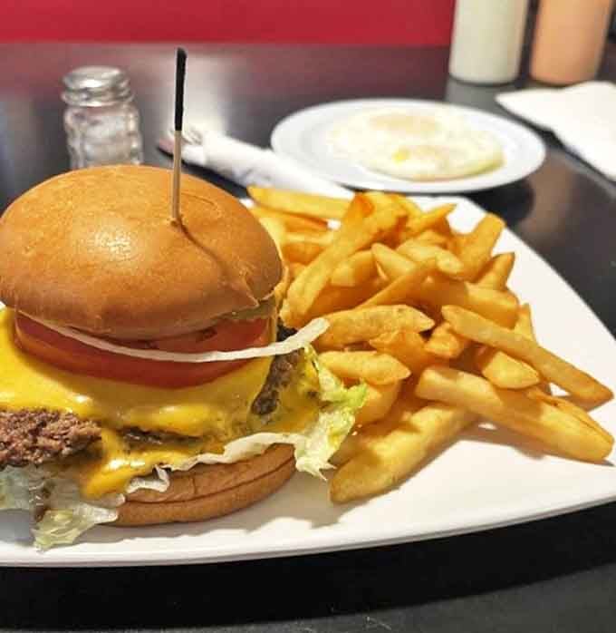 This isn't just a cheeseburger&mdash;it's edible architecture with melty cheese cascading down a perfectly grilled patty. The fries? Just the supporting cast.