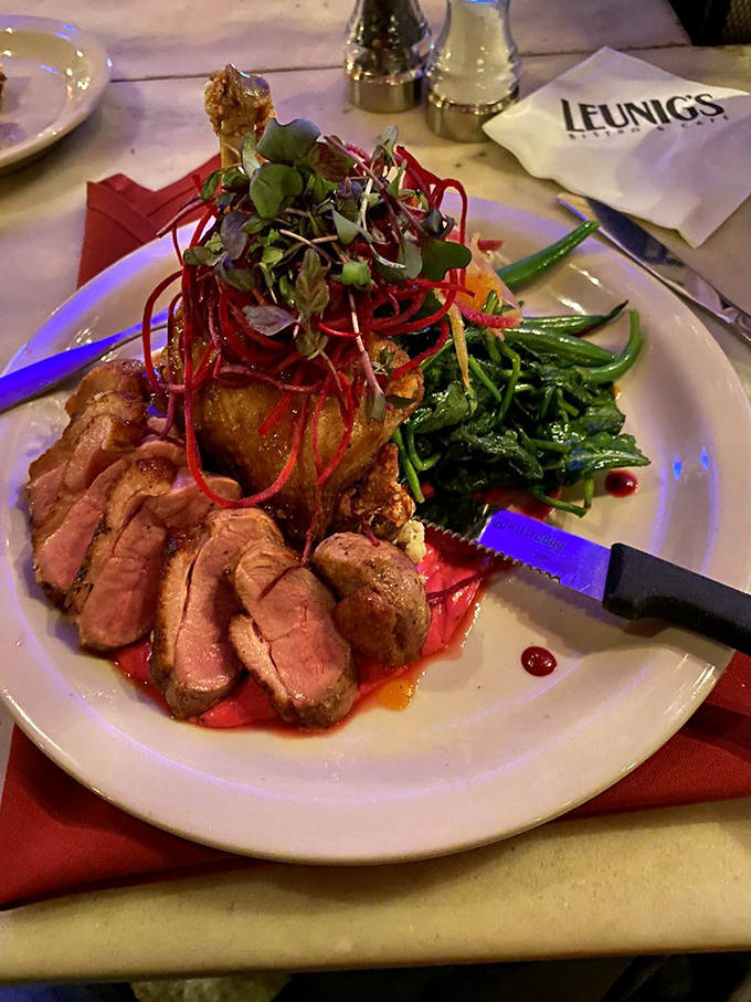 The duck breast arrives like a celebrity, dressed in its finest reduction and wearing a jaunty hat of microgreens.