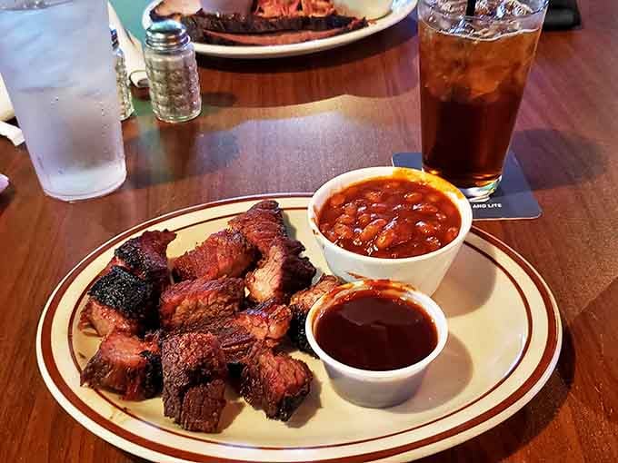 Burnt ends: those magical morsels where smoke, spice, and time create little cubes of heaven. Paired with beans that clearly weren't poured from a can.