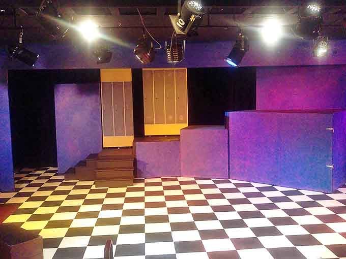 The checkered floor of Evergreen Playhouse awaits its next production&mdash;proof that you don't need Broadway prices to experience theatrical magic.