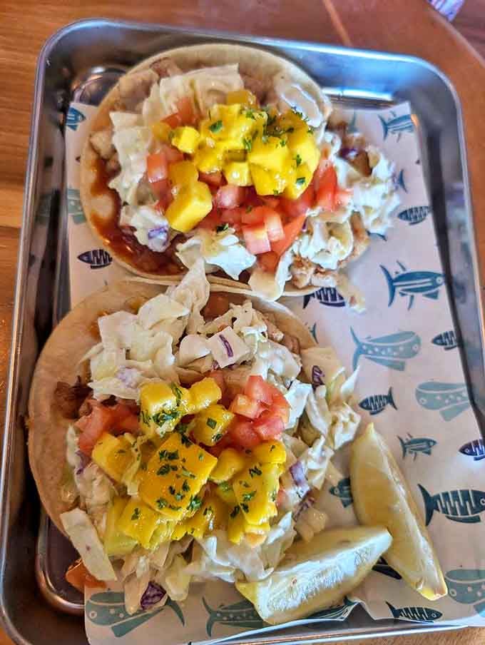 Architecture on a plate: these fish tacos are the Frank Lloyd Wright of fast-casual dining. Mango salsa jewels crown these corn tortilla masterpieces.